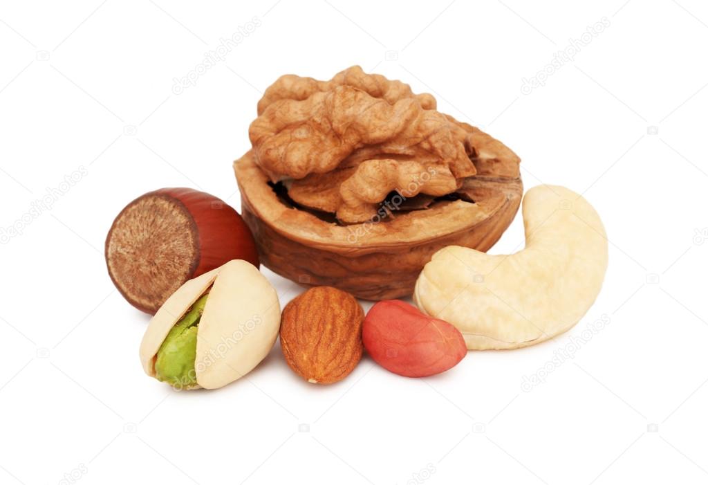 Stack from different kinds of nuts (isolated) Stock Photo by ©ArtemSam ...