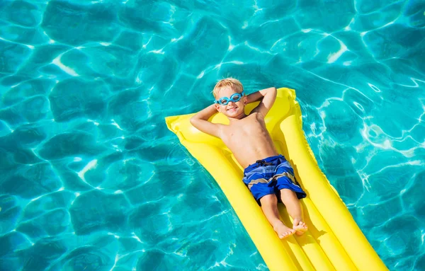 Boy Relaxing and Having Fun in Swimming Pool on Yellow Raft Stock Photo ...