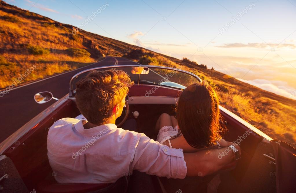 Romantic Couple Driving on Beautiful Road at Sunset Stock Photo by ...