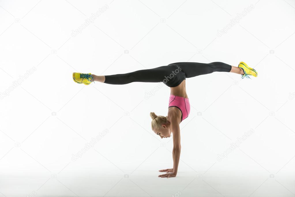 Rhythmic gymnast doing exercise in studio. — Stock Photo © bezikus ...