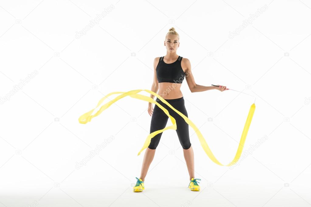 Rhythmic gymnast doing exercise with a ribbon — Stock Photo © bezikus ...