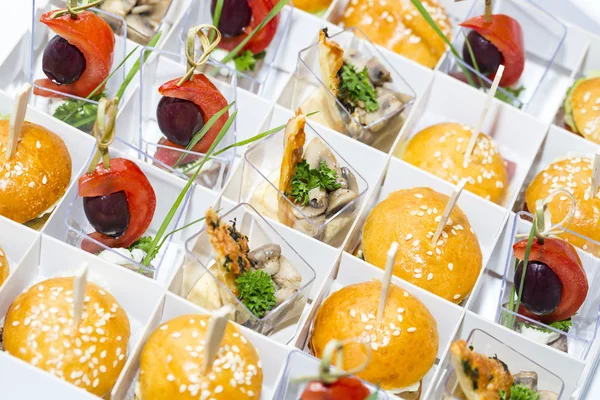 Mini canapes in plastic cups decorated — Stock Photo © Lester120 #117890726