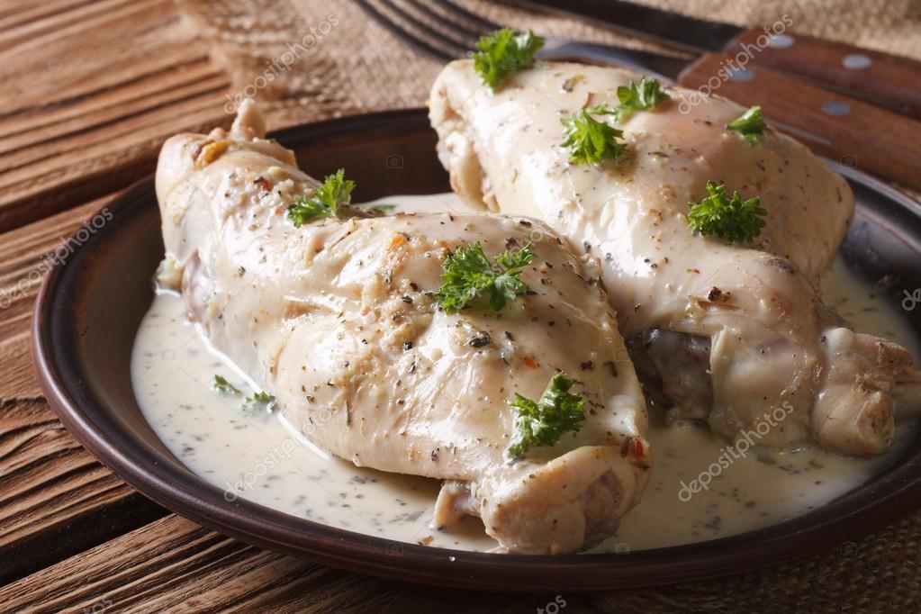 Rabbit leg cooked in cream close up on a plate. horizontal — Stock ...
