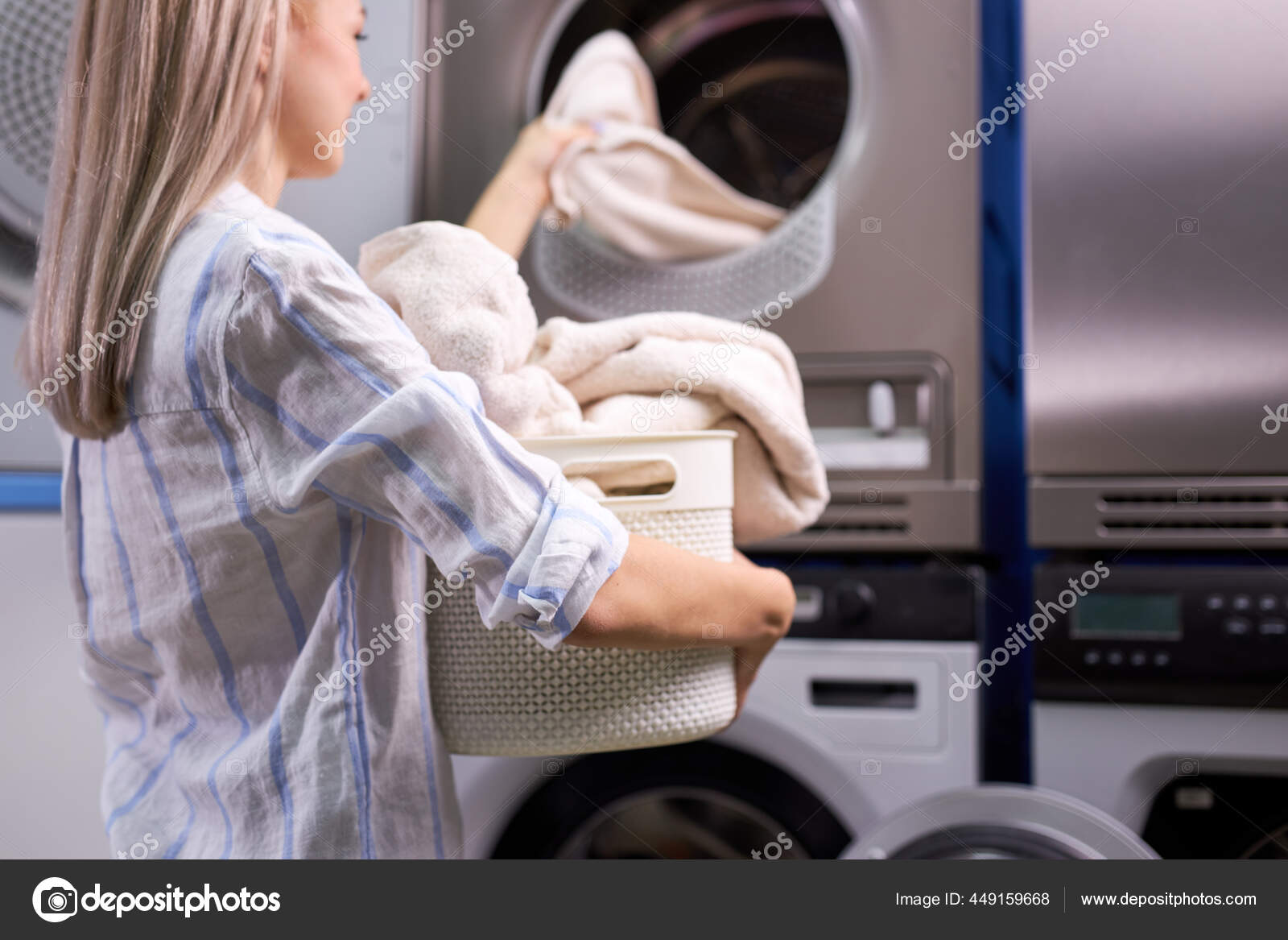 Housework: woman loading clothes into washing machine — Stock Photo ...