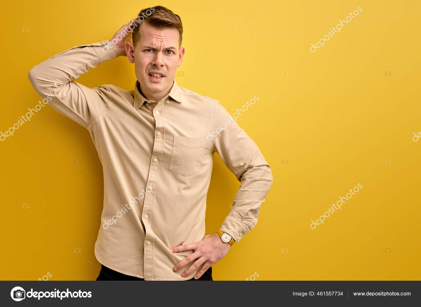 Doubtful young caucasian guy stand thinking, scratch back of head ...