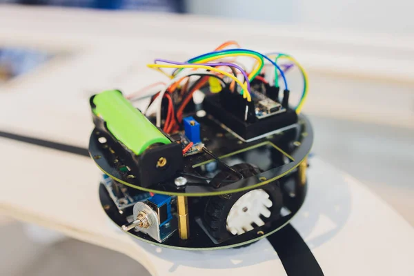 Homemade robot on wheels with eyes. Hobby robotics. - Stock Image ...