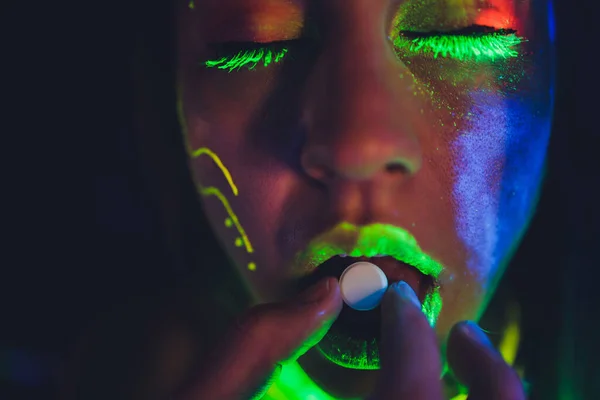 Beautiful girl with lsd on tongue in nightclub with pink smoke. Stock ...