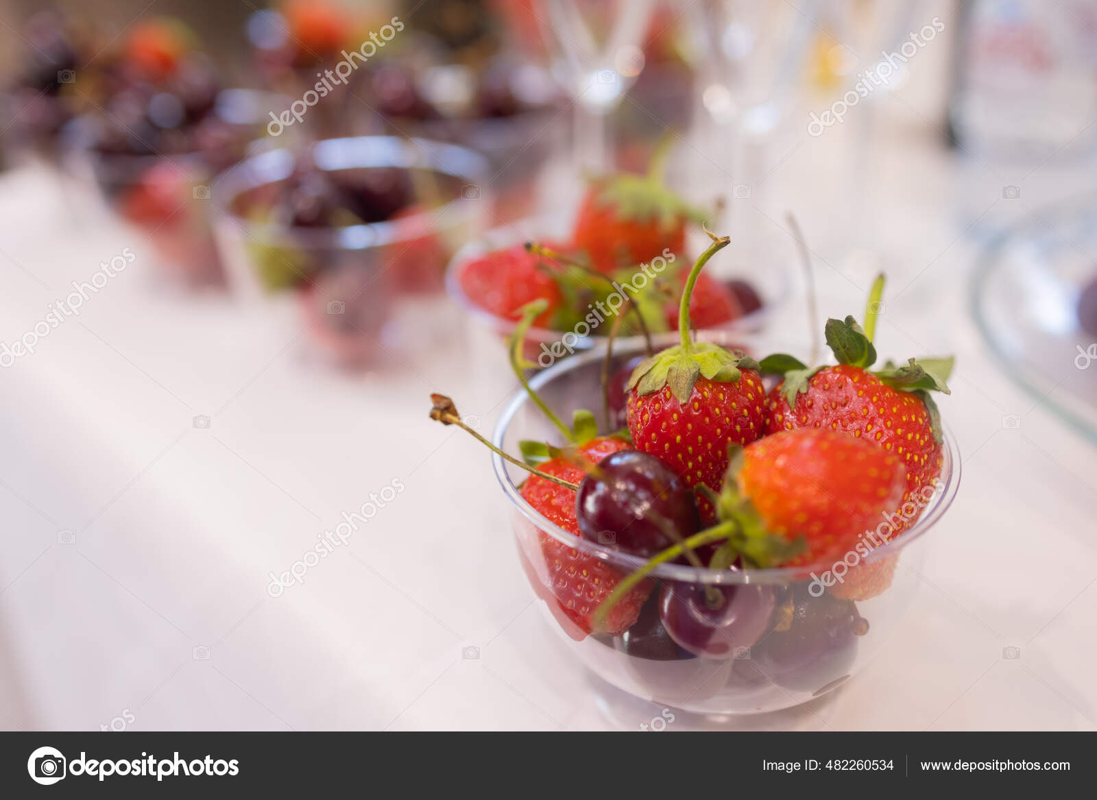 Dinner table with snacks decorated with beautiful summer flowers. Food ...