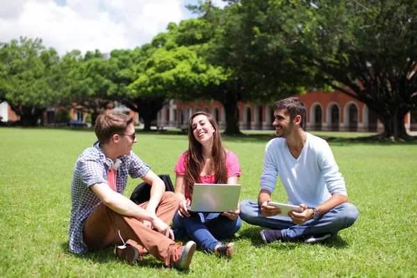 Happy College students using computer - Stock Image - Everypixel