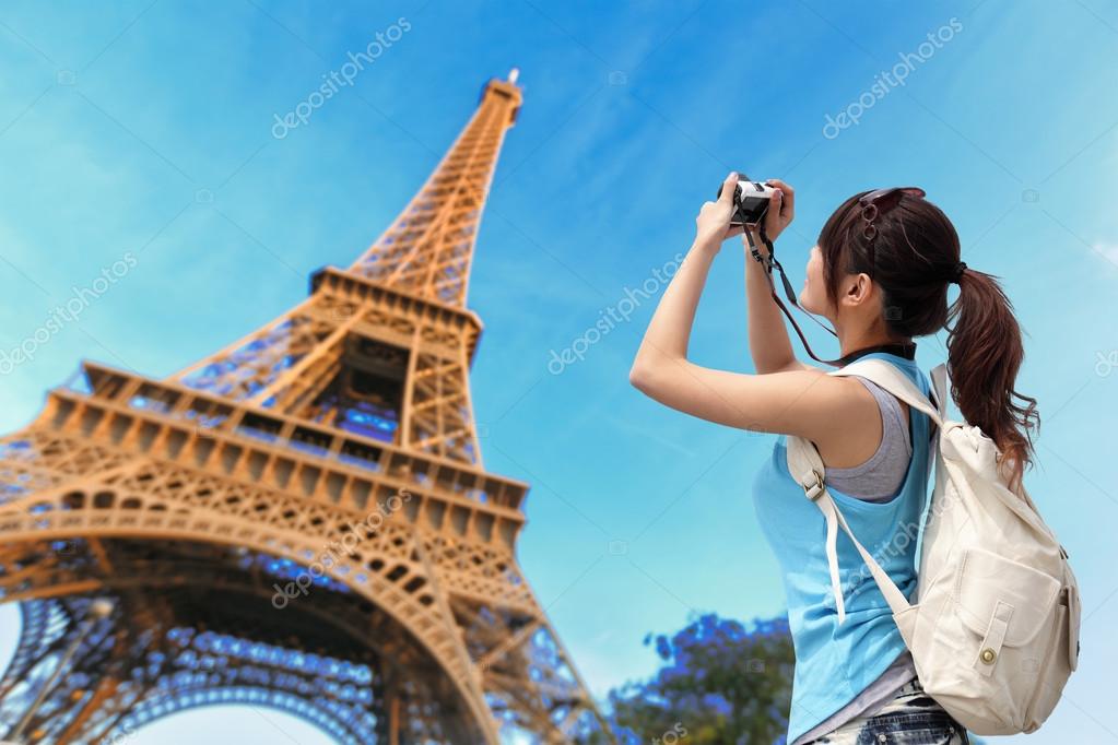 Woman in Paris taking a picture — Stock Photo © ryanking999 #67294473