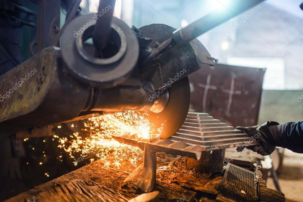 Industrial factory power tool used by worker for grinding and cutting ...