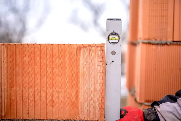 Construction mason worker bricklayer installing brick walls — Stock ...