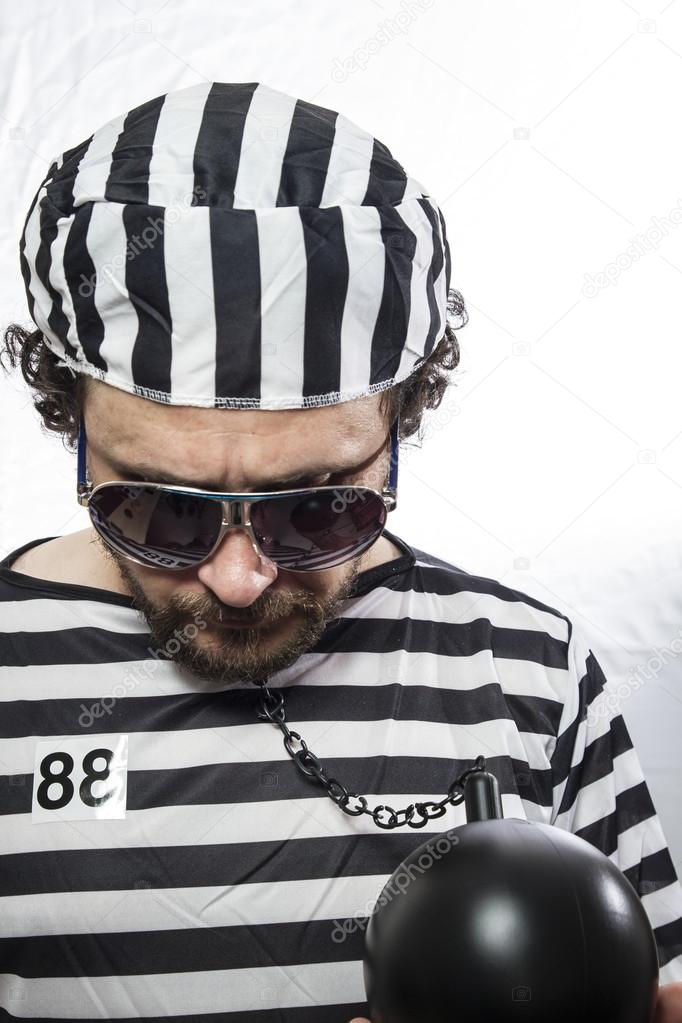 Man prisoner in prison garb Stock Photo by ©outsiderzone 82159544