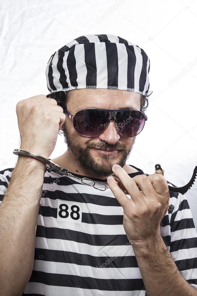 Man prisoner in prison garb Stock Photo by ©outsiderzone 82159618