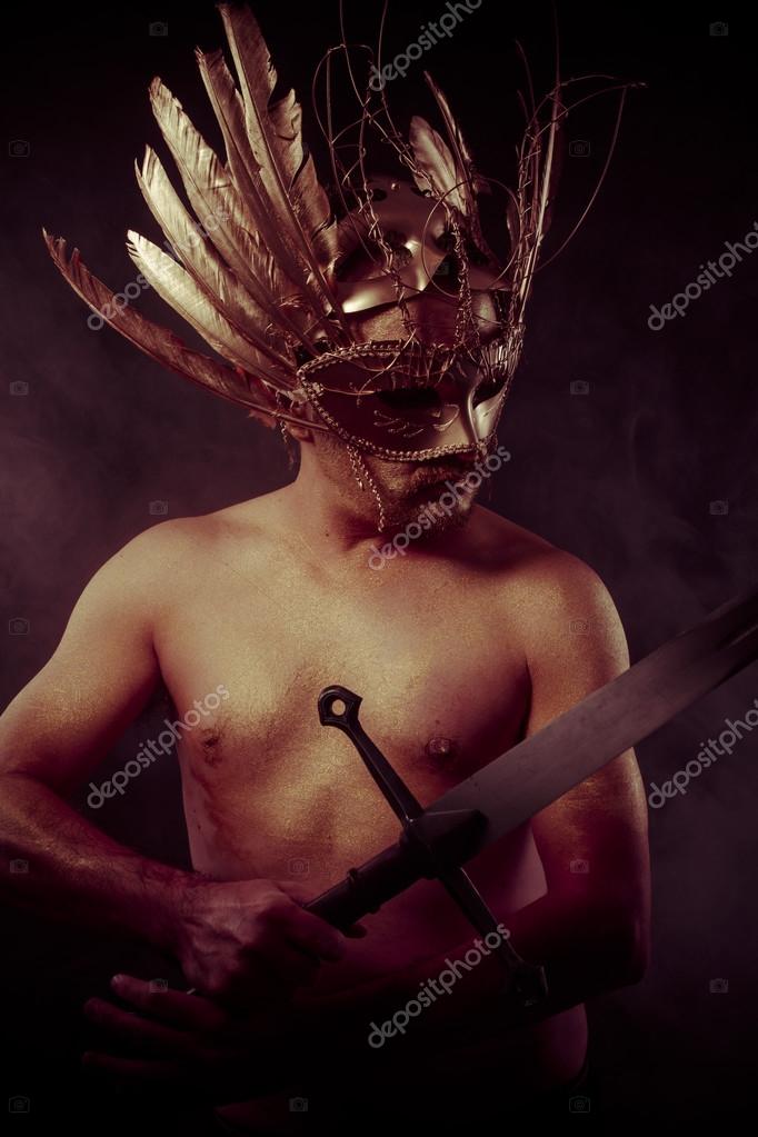 Warrior with golden mask Stock Photo by ©outsiderzone 87014824