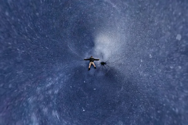 Stressed man laying on ice in winter Stock Photo by ©xload 105641160