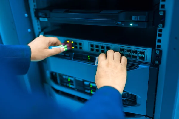 Man fix server network in data center room - Stock Image - Everypixel
