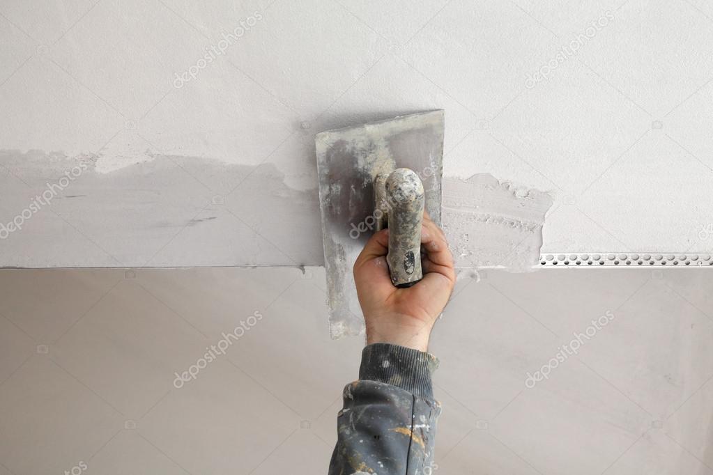 Worker install batten at ceiling and wall Stock Photo by ©simazoran ...