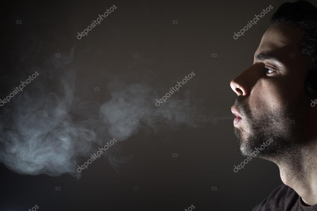 Profile of a person smoking — Stock Photo © malekas #66200067