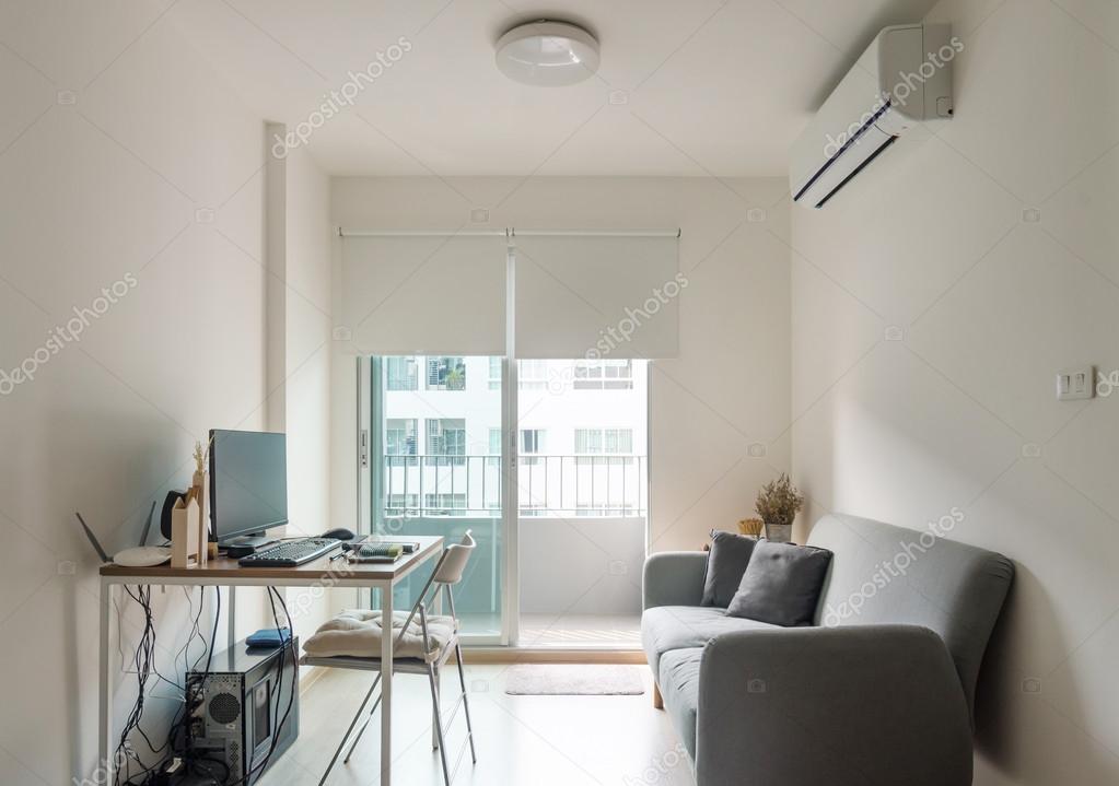 Living room with working table — Stock Photo © siraanamwong #104538468