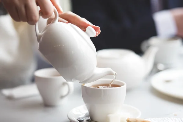 Pouring tea Stock Photos, Royalty Free Pouring tea Images | Depositphotos