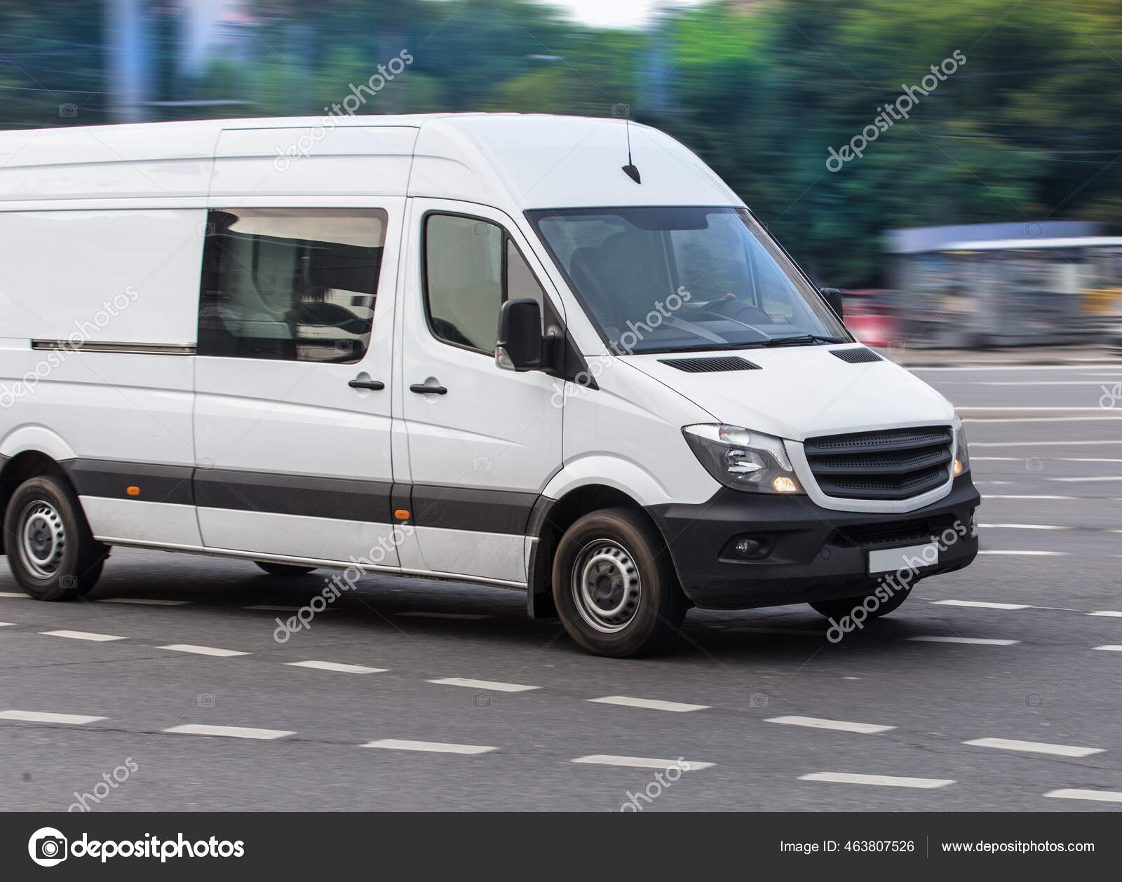 White Minibus Goes City Street Stock Photo by ©Apriori 463807526