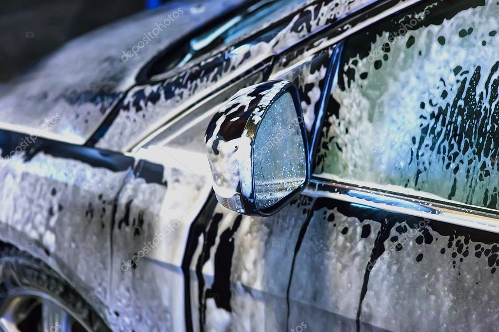 Car covered with foam Stock Photo by ©Apriori 73951109