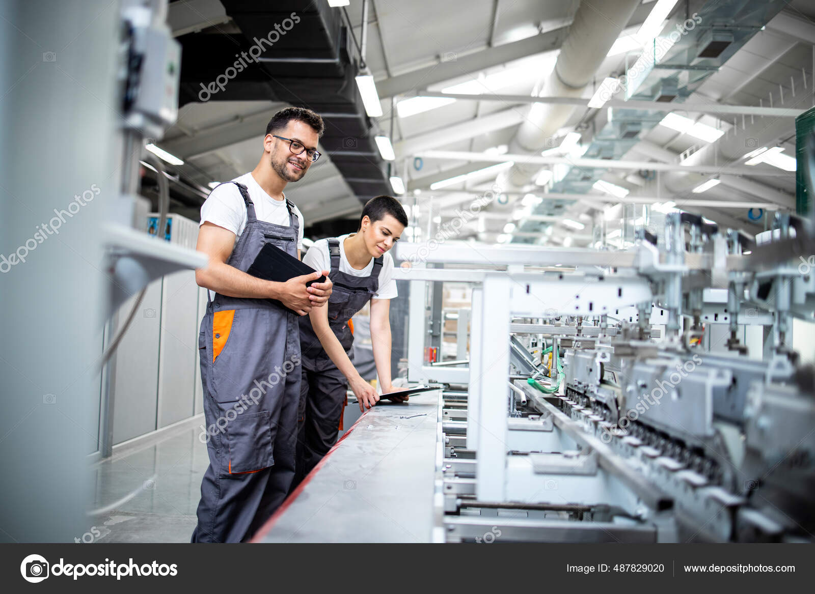 Production Line Workers Controlling Manufacturing Process Modern ...