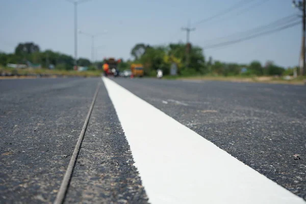 Road traffic paint White on the asphalt surface Stock Photo by ...