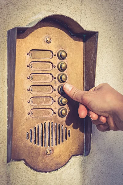 Finger ringing a door bell — Stock Photo © ueuaphoto #25277613