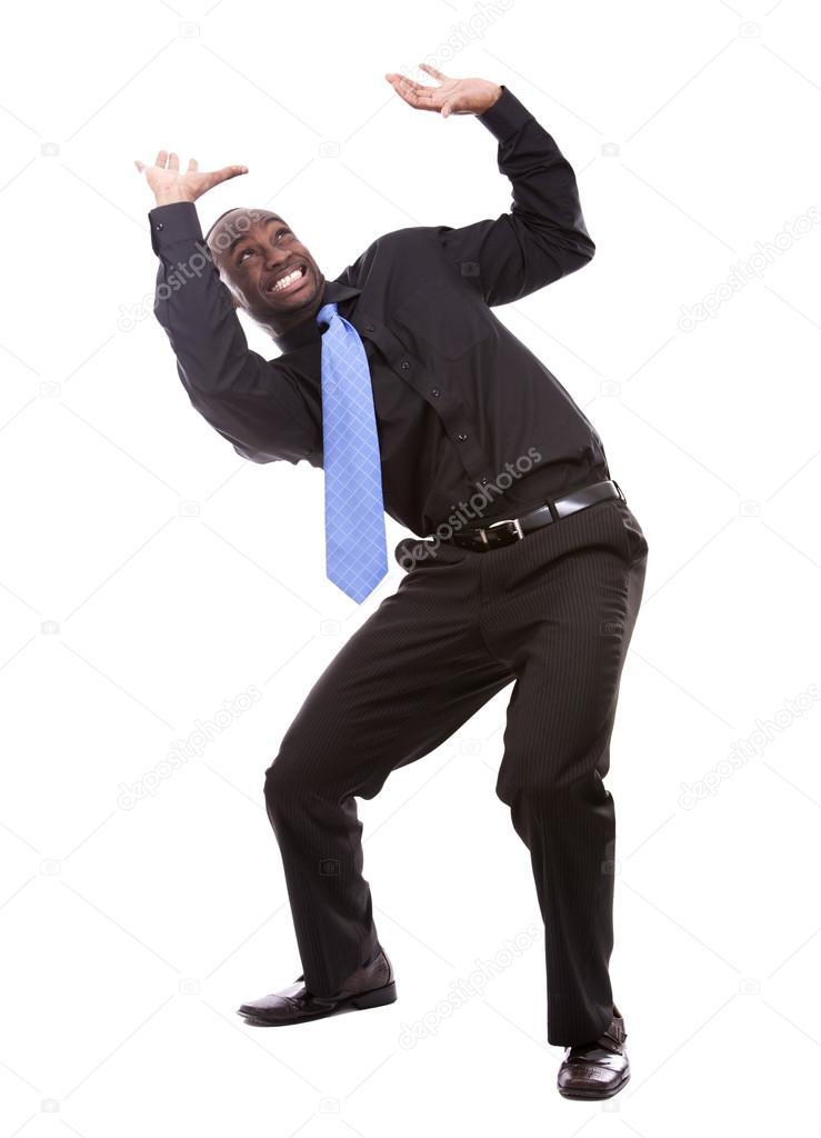 Handsome black man pushing object Stock Photo by ©zdenkam 98784858