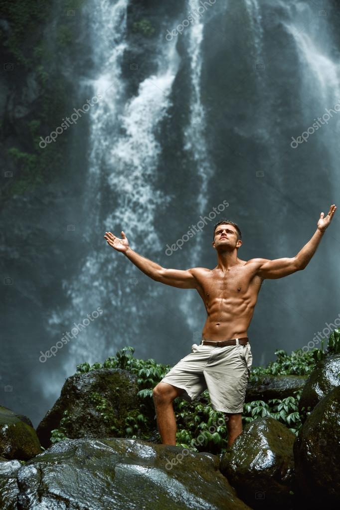 Free Man Feeling Freedom Raising Hands Near Waterfall. Health Stock ...