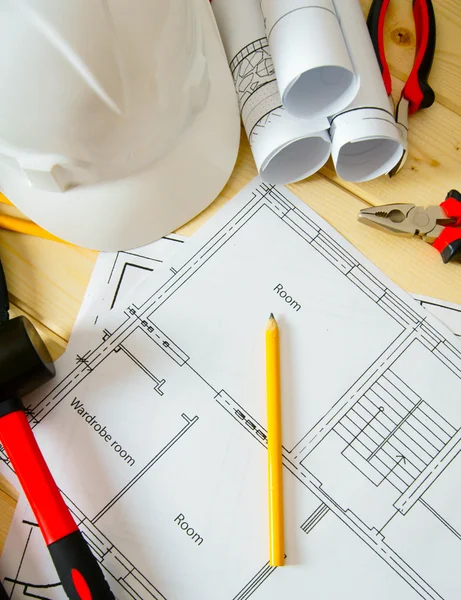 House construction. Drawings for building, helmet and others tools on ...