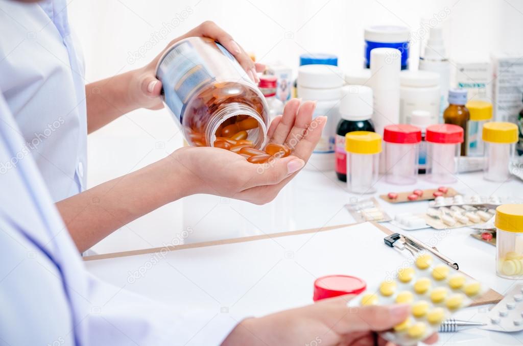 Pharmacists working in office Stock Photo by ©psphotography 77534546