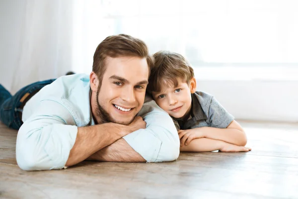 Little boy and his father on wooden floor Stock Photo by ©dima ...