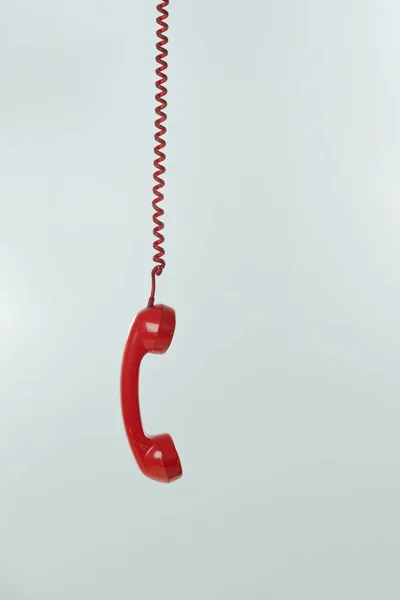 Red telephone cable hanging — Stock Photo © Gelpi #14758251