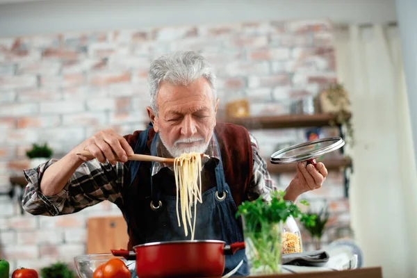 Senior man cooking Stock Photos, Royalty Free Senior man cooking Images ...