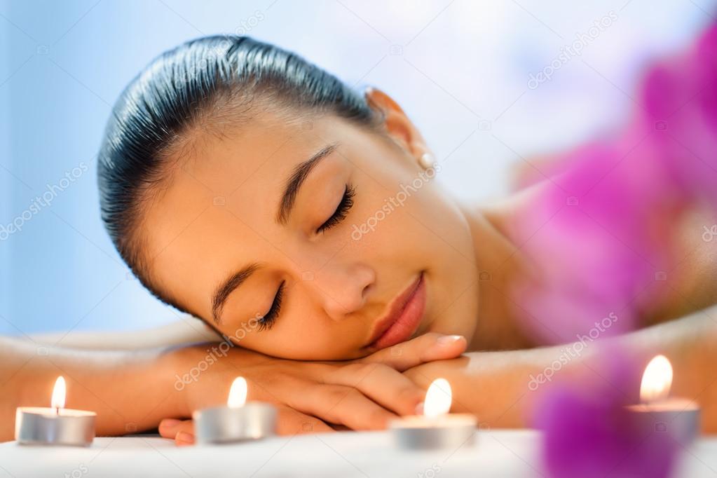 Woman relaxing after massage Stock Photo by ©karelnoppe 83687486