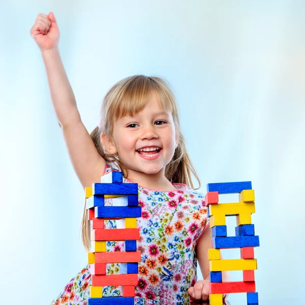 Girl building structure with blocks Stock Photo by ©karelnoppe 91150896
