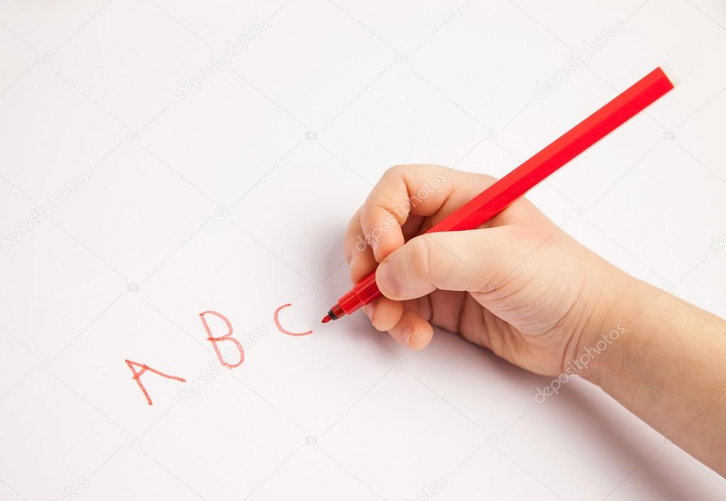 Hand of a child writing letters Stock Photo by ©zestmarina 64745593
