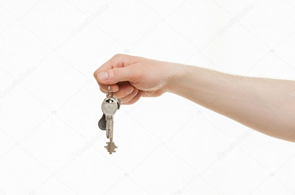 Man's hand holding a bunch of keys Stock Photo by ©zestmarina 76131405