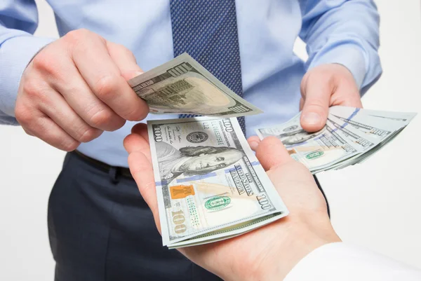 Hands exchanging money Stock Photo by ©zestmarina 95150182