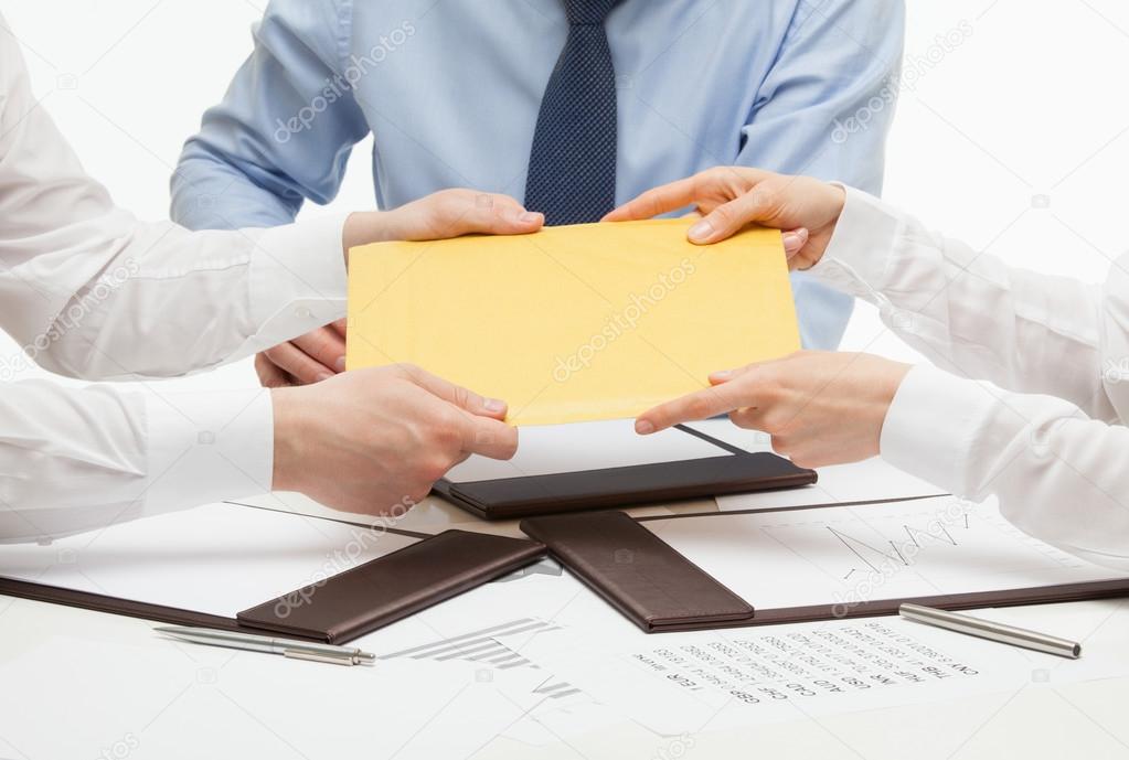 Business people passing envelope Stock Photo by ©zestmarina 84856818