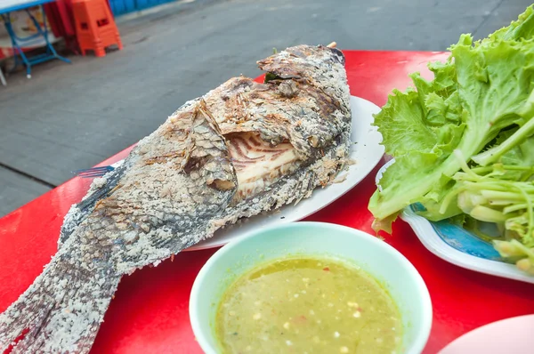 Thai grilled fish served at a street-side restaurant in Bangkok ...