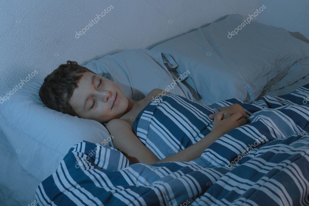 Boy Sleeping In Bed