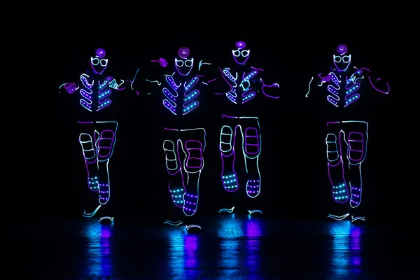 Dance team in costumes of the LEDs Stock Photo by ©VlaDee 110033414