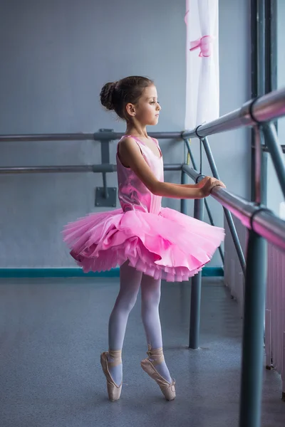 Cute little ballet dancer at training class - Stock Image - Everypixel