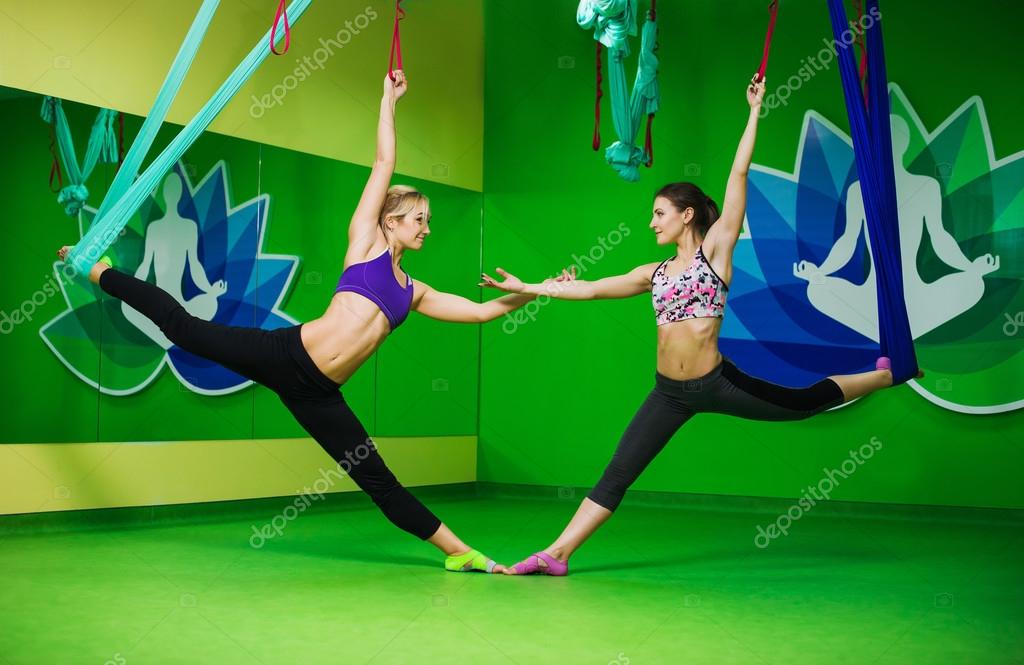 Aerial yoga practicing - anti gravity yoga with scarves — Stock Photo ...
