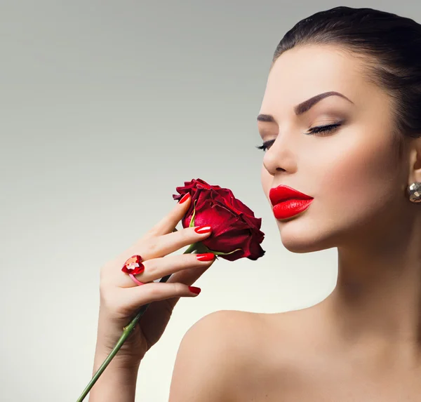 Girl face portrait with red rose Stock Photo by ©Subbotina 123319990