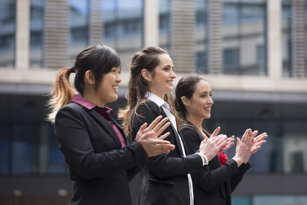 Female executives clapping hands — Stock Photo © sjenner13 #123458394